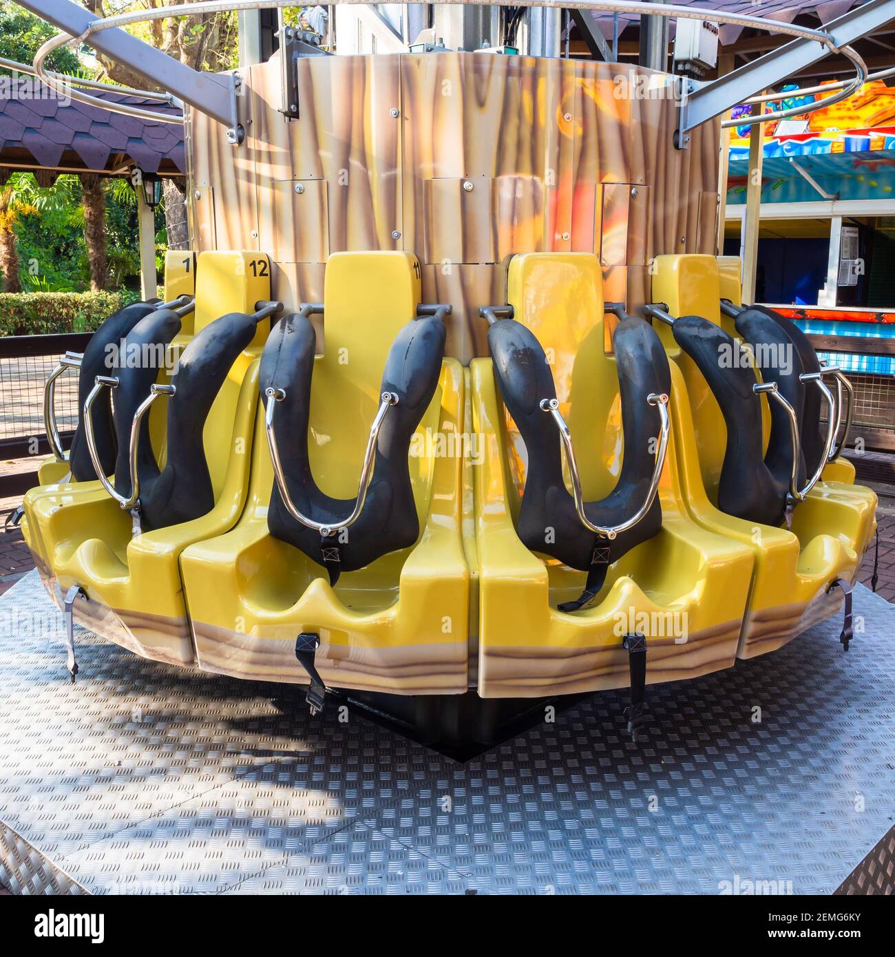 Russia, Sochi 15.02.2021. Yellow carousel with empty seats in a circle ...