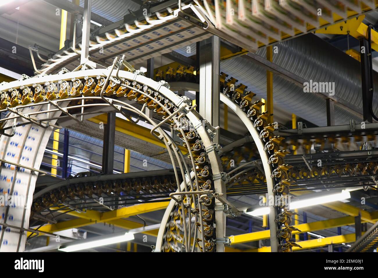 modern machines for transportation in a large print shop for production ...