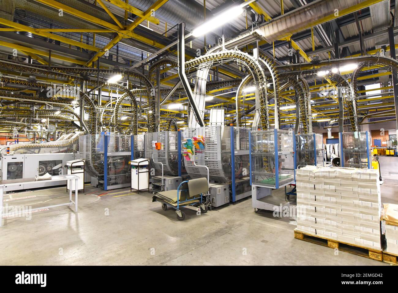 modern machines for transportation in a large print shop for production ...