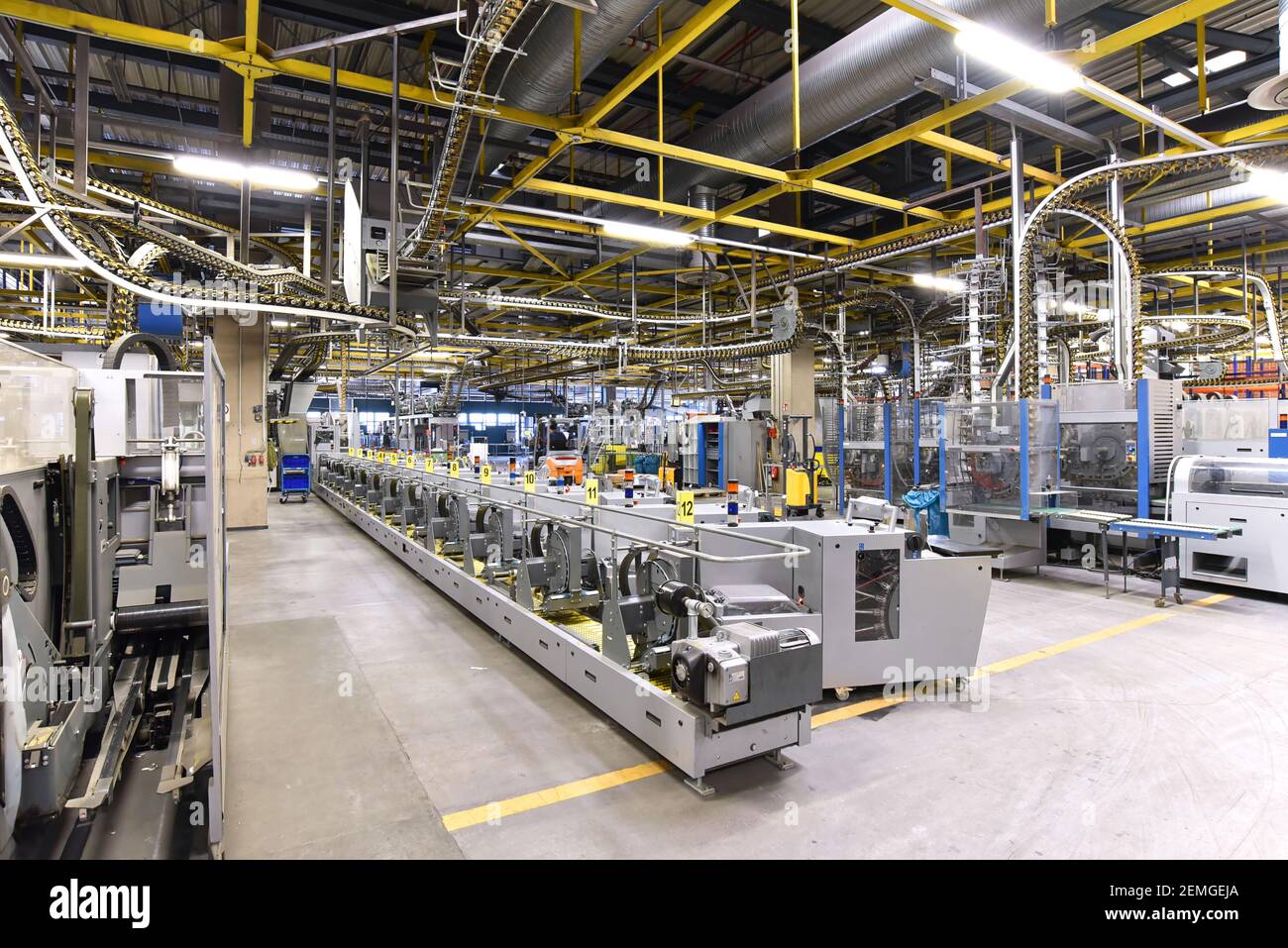 modern machines for transportation in a large print shop for production ...