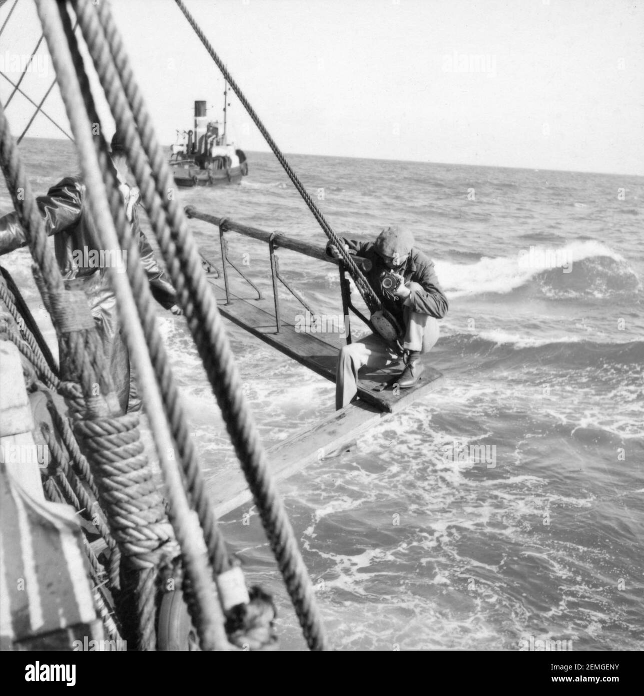 JOHN HUSTON on set location candid filming on the Irish Sea during production of MOBY DICK 1956 ...
