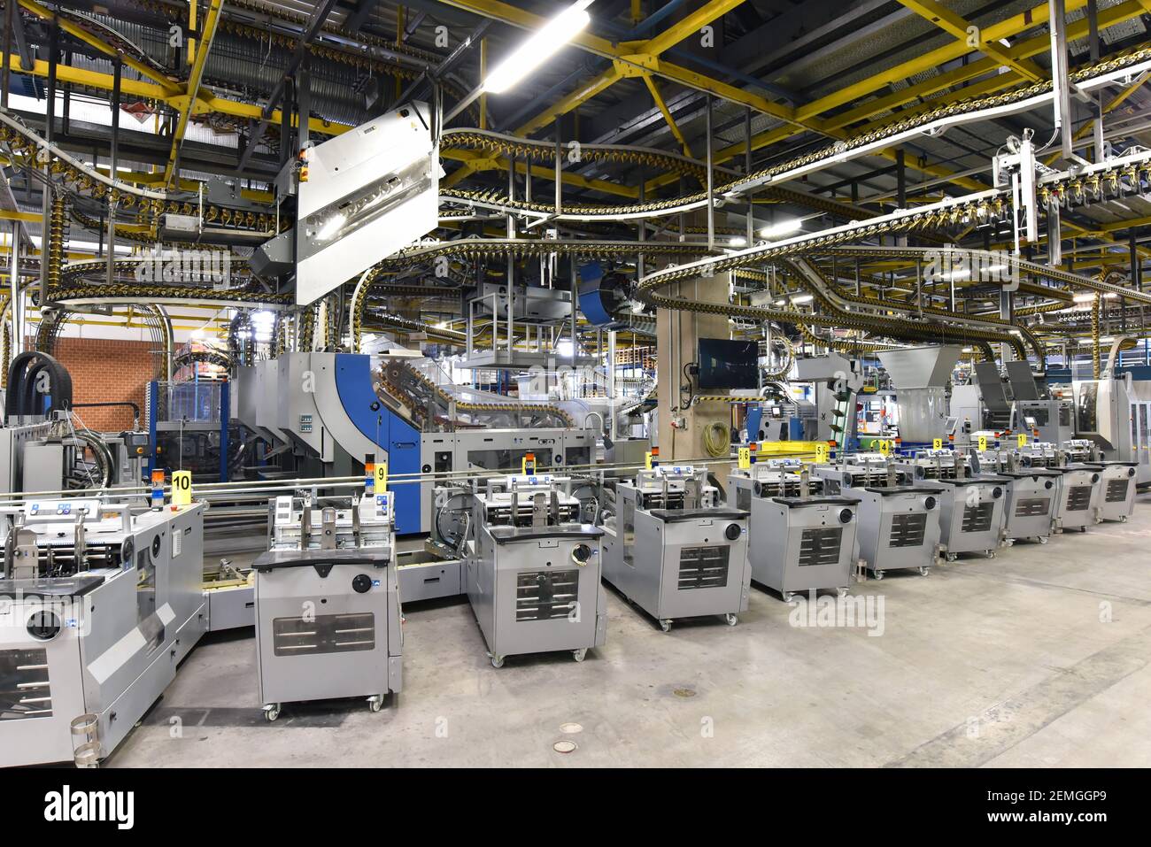 modern machines for transportation in a large print shop for production ...