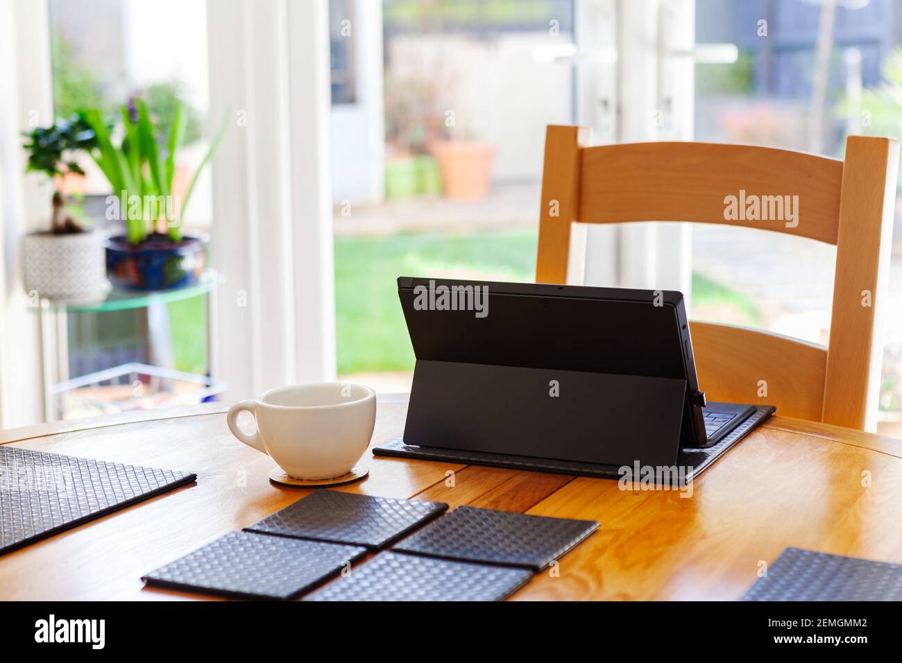 Working at a coffee table hi-res stock photography and images - Alamy