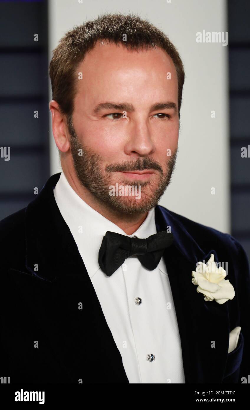 Tom Ford walking on the red carpet at the 2019 Vanity Fair Oscar Party ...