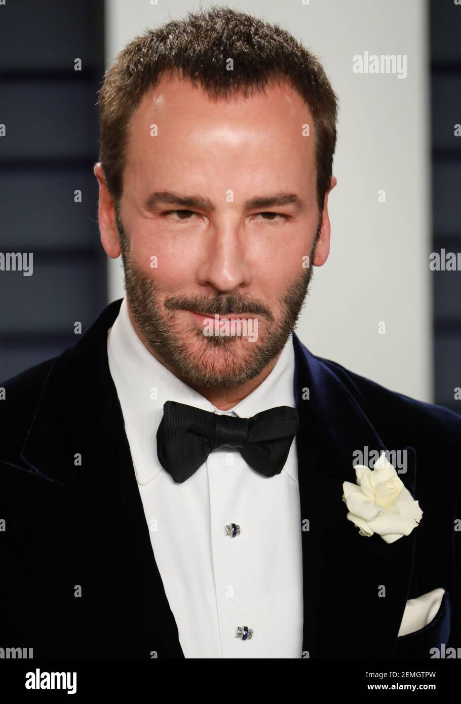 Tom Ford walking on the red carpet at the 2019 Vanity Fair Oscar Party ...