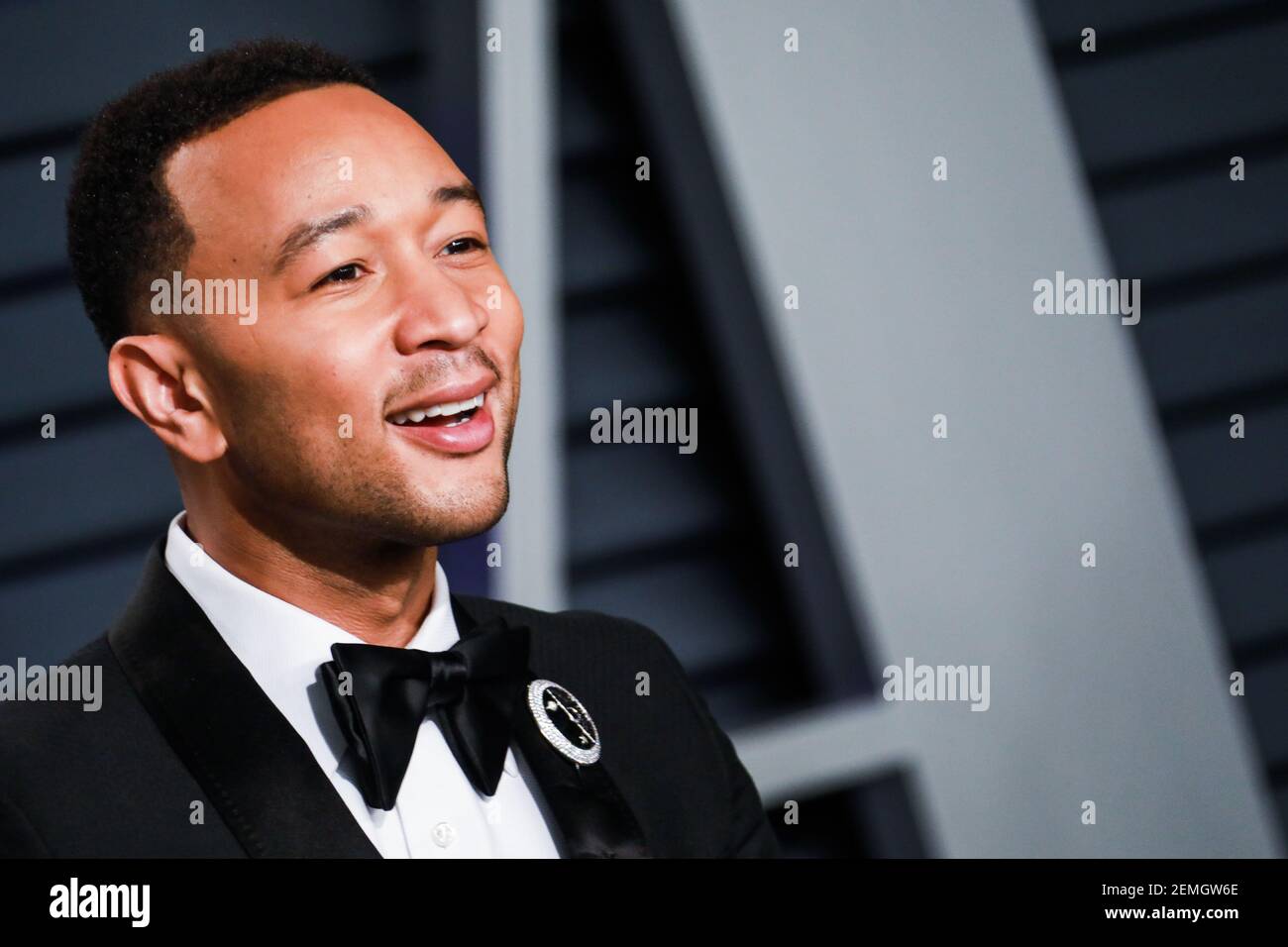 John Legend walking on the red carpet at the 2019 Vanity Fair Oscar ...