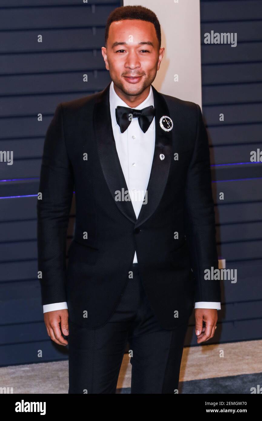 John Legend walking on the red carpet at the 2019 Vanity Fair Oscar ...