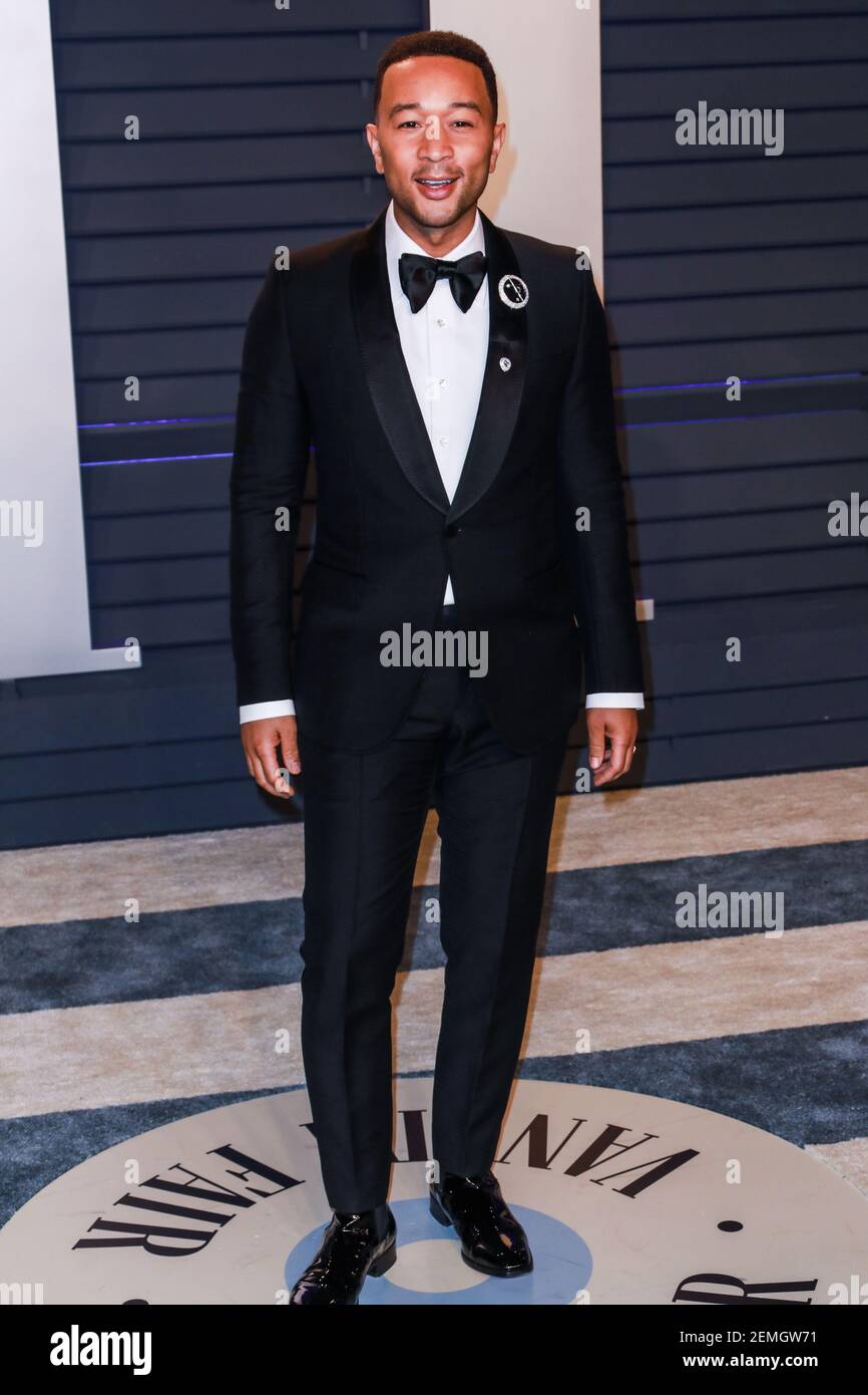 John Legend walking on the red carpet at the 2019 Vanity Fair Oscar ...