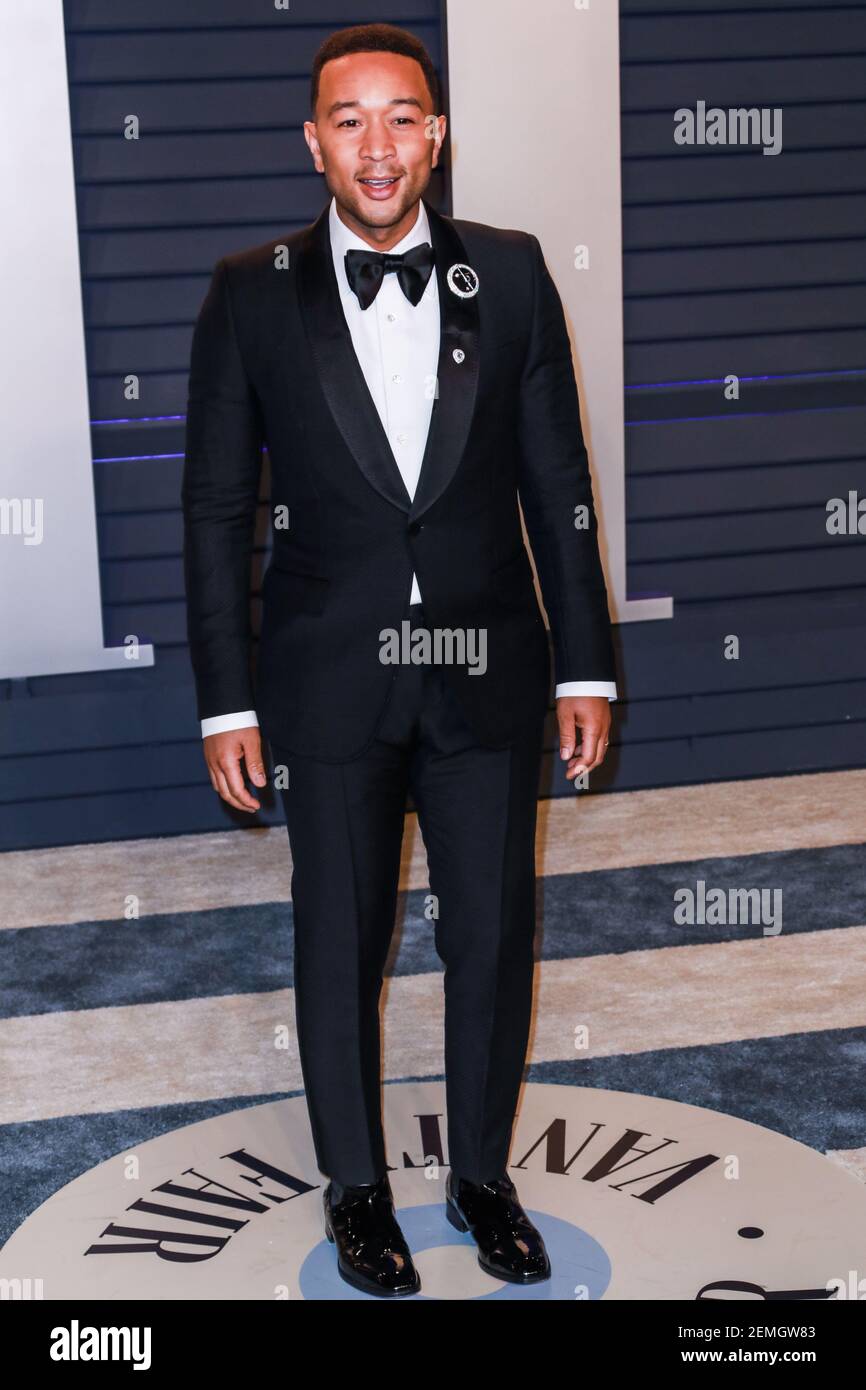 John Legend walking on the red carpet at the 2019 Vanity Fair Oscar ...