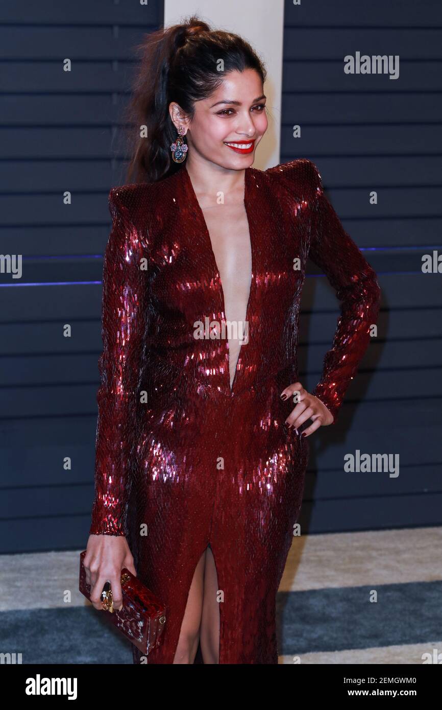 Freida Pinto walking on the red carpet at the 2019 Vanity Fair Oscar ...