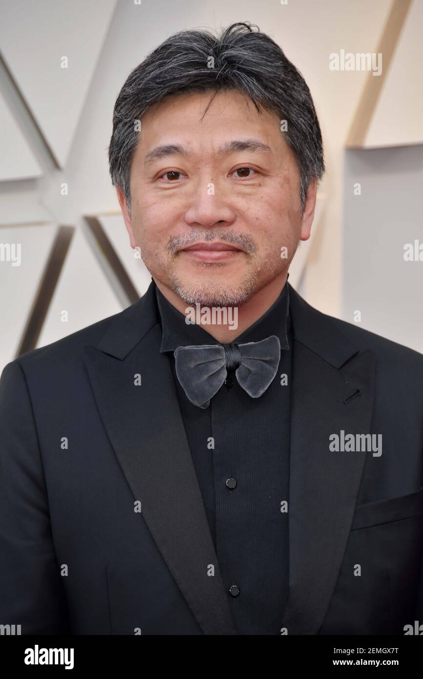 Director Hirokazu Kore-eda walking on the red carpet at the 91st ...