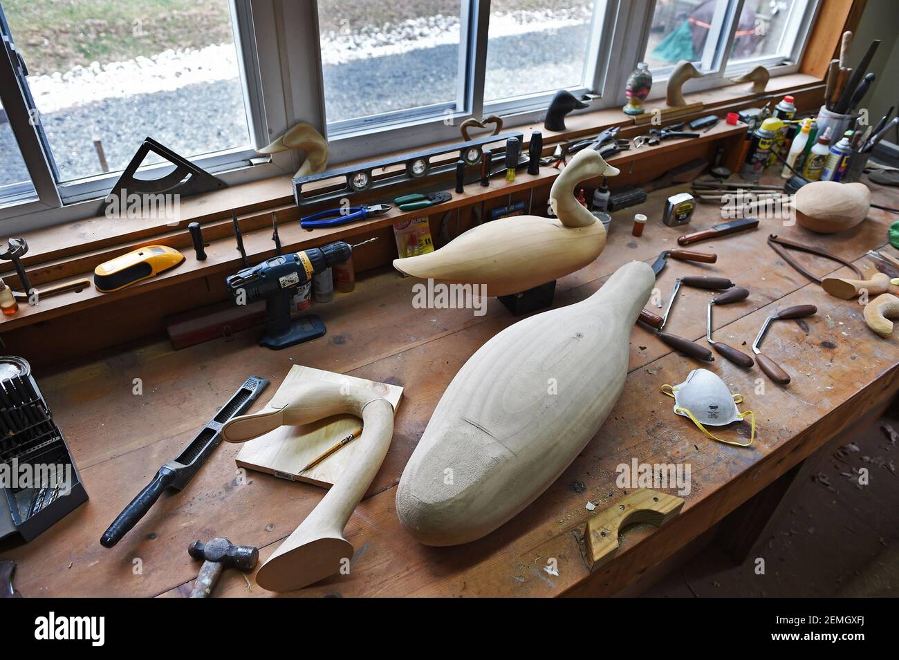 The work bench of decoy carver Dan Carson, who can turn a chunk of wood ...