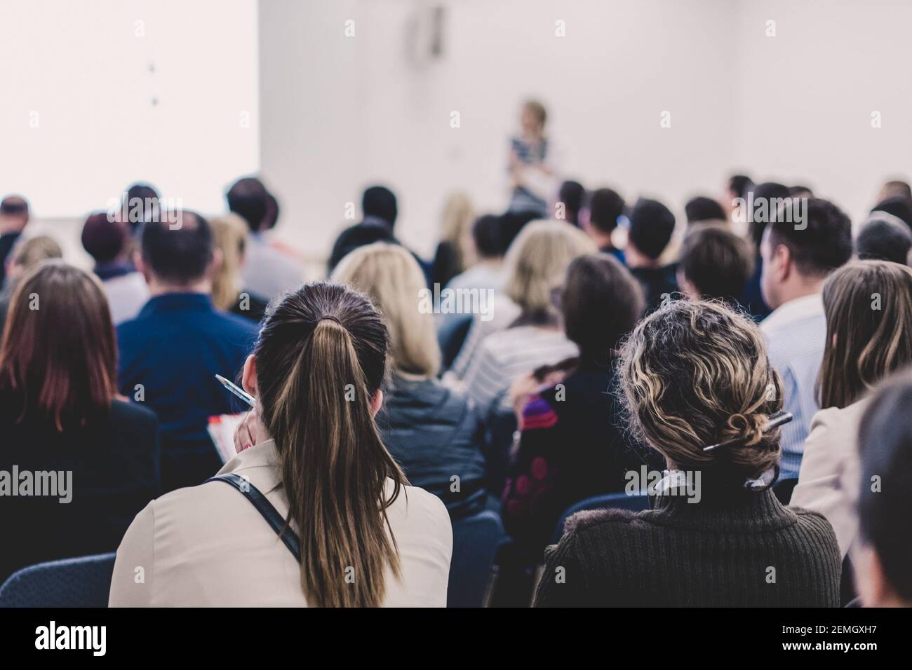 Woman giving presentation on business conference Stock Photo - Alamy