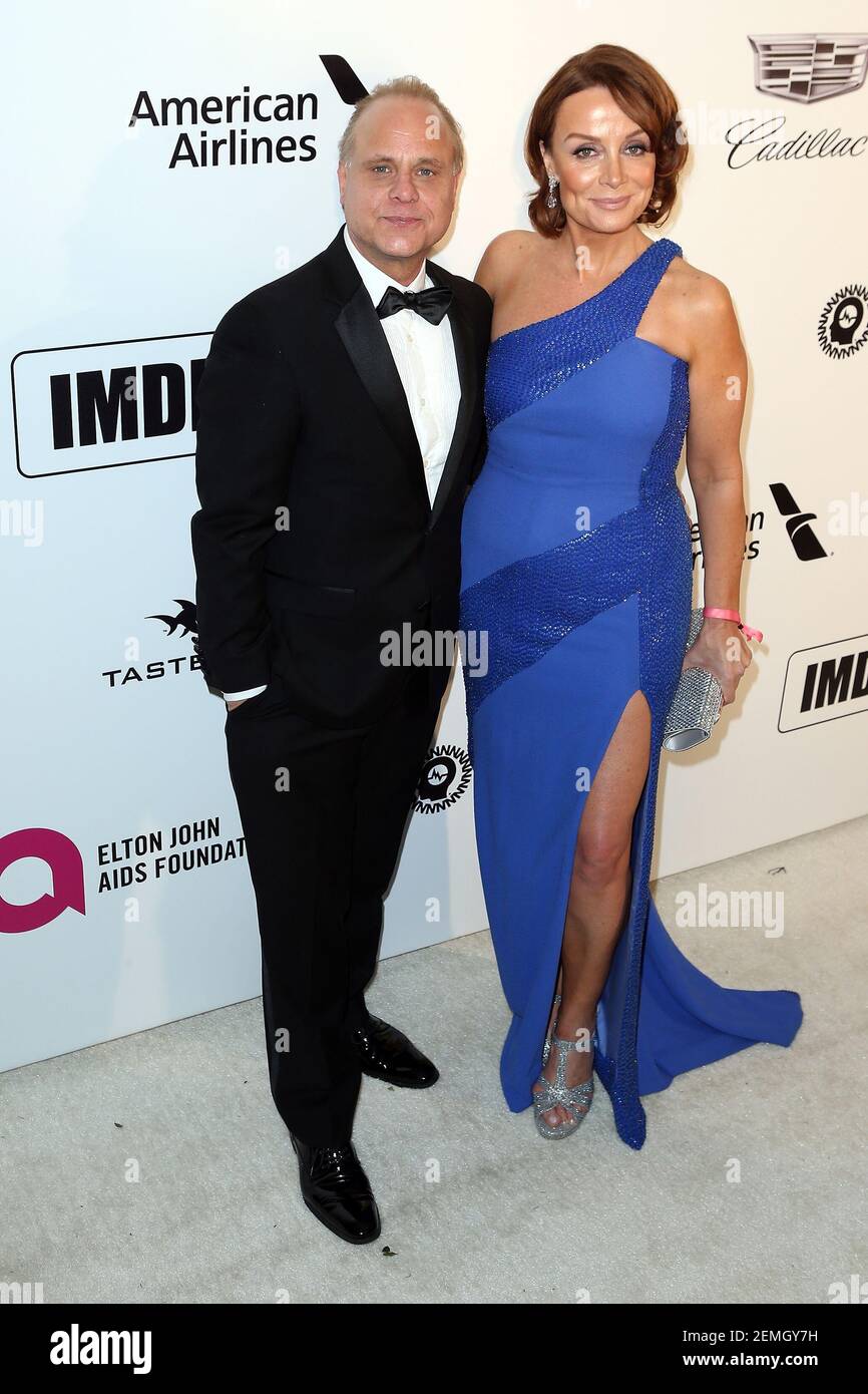 Dennis W. Hall, Kristin Cary attend the 27th Annual Elton John AIDS ...