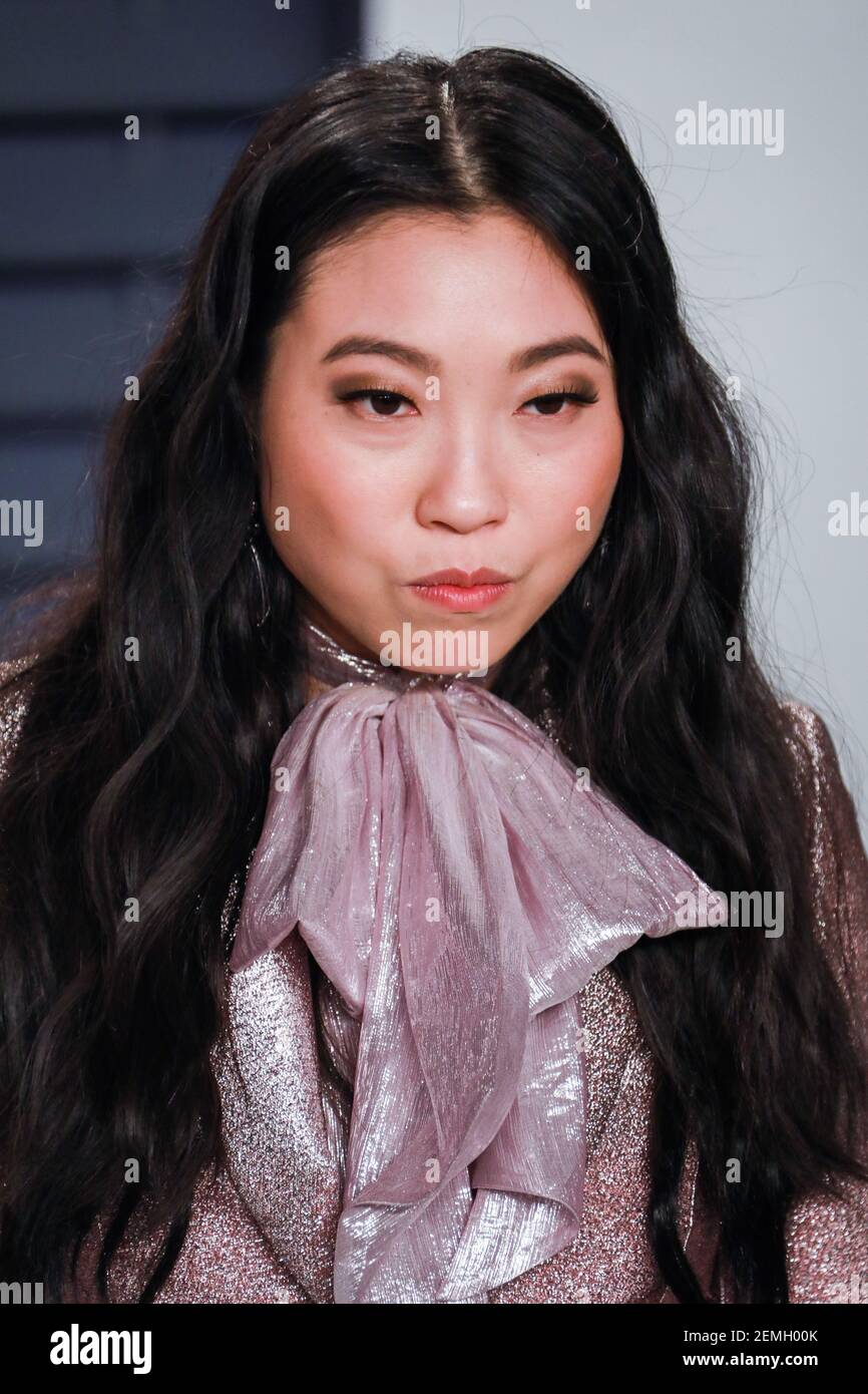 Awkwafina walking on the red carpet at the 2019 Vanity Fair Oscar Party ...