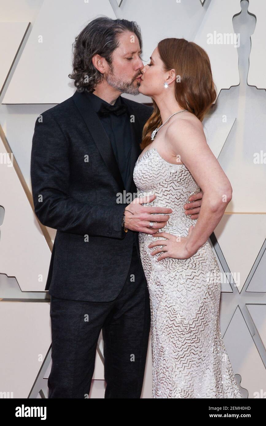 Darren Le Gallo and Amy Adams walking on the 2019 Oscars red carpet at ...