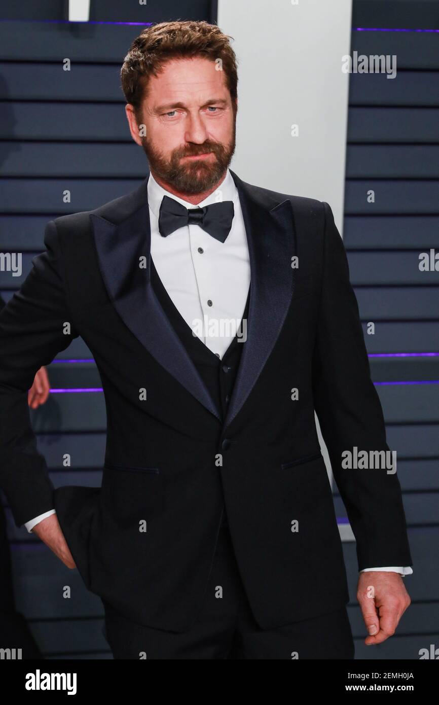 Gerard Butler walking on the red carpet at the 2019 Vanity Fair Oscar ...