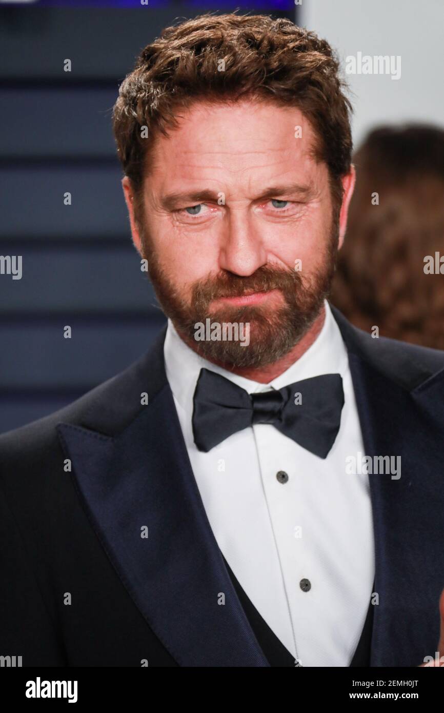 Gerard Butler walking on the red carpet at the 2019 Vanity Fair Oscar ...