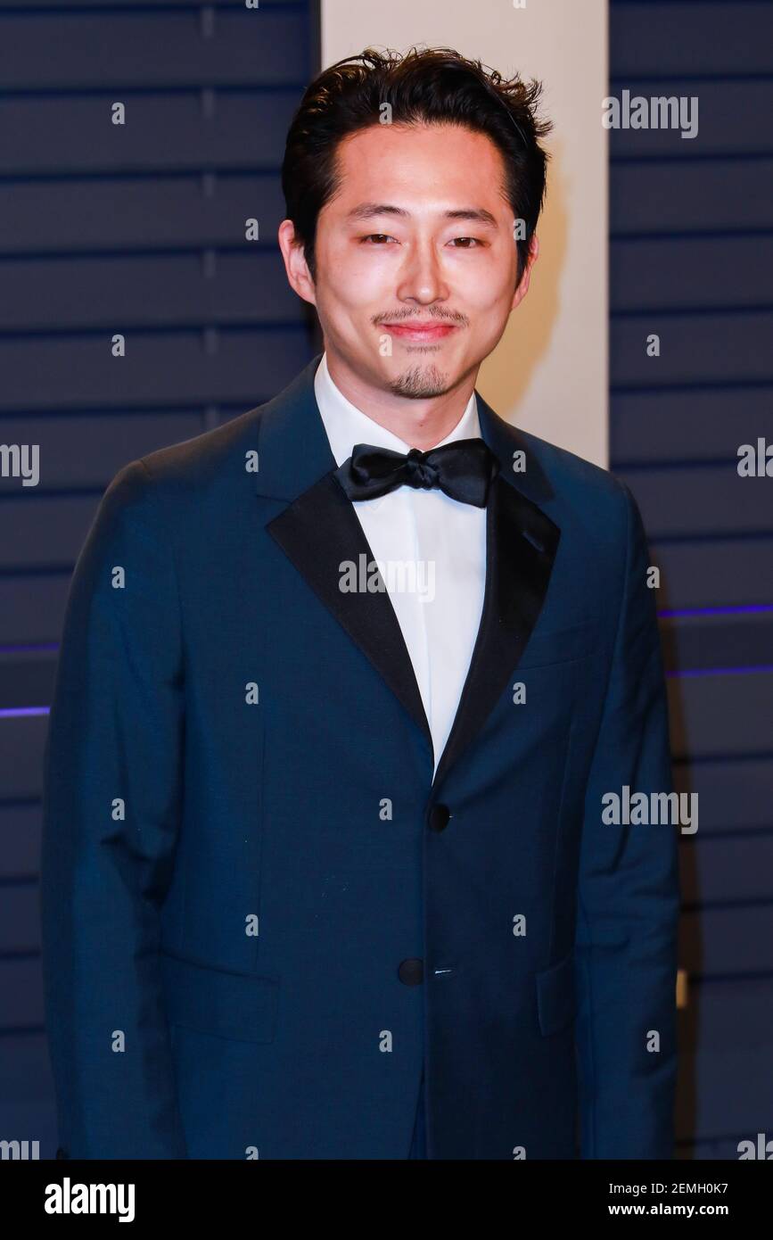 Steven Yeun walking on the red carpet at the 2019 Vanity Fair Oscar ...
