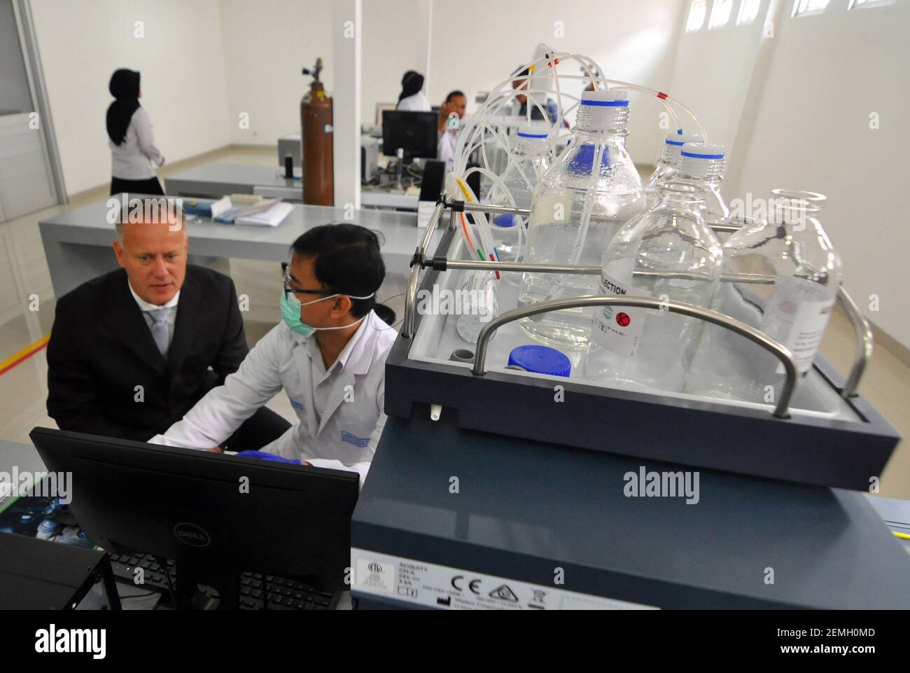 Collie Brown (L) UNODC Country Manager was seen listening to the ...
