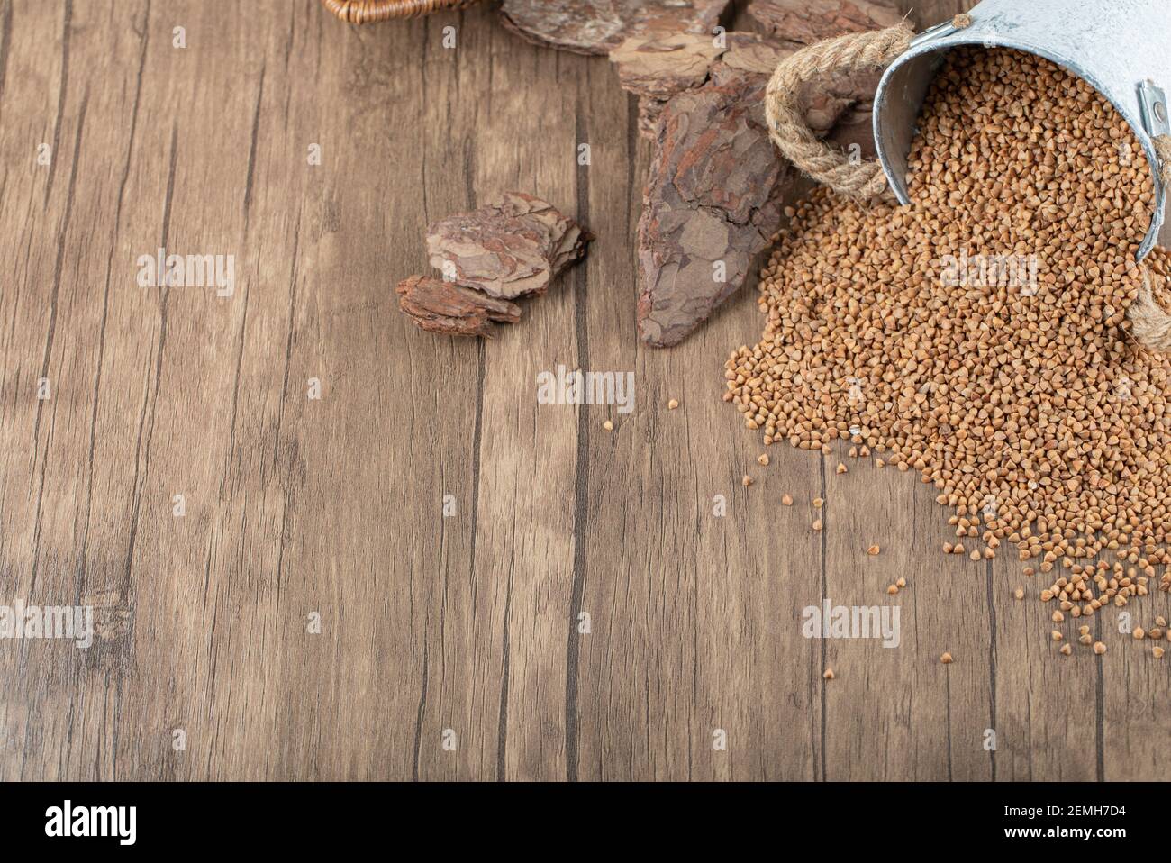 Pile of raw buckwheat out of metal bucket Stock Photo - Alamy