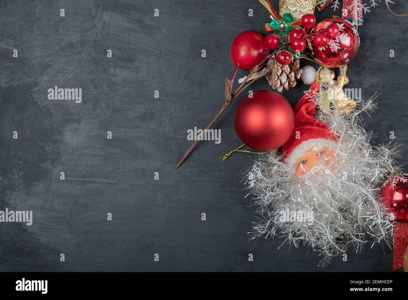 Christmas wreath with baubles and Santa on dark background Stock Photo ...