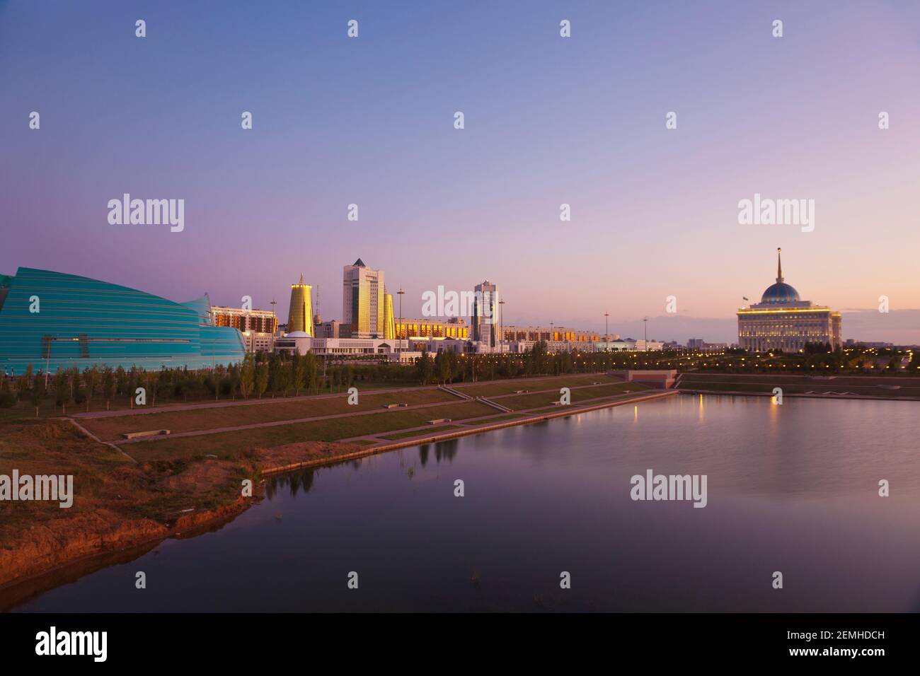 Kazakhstan, Astana, View of city skyline reflecting in Ishim River ...