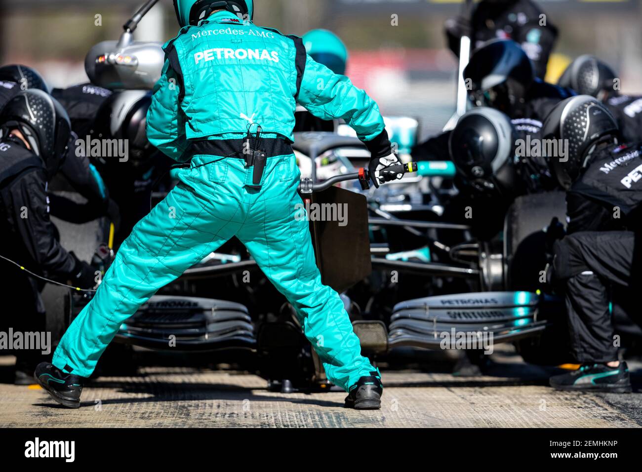 Lewis Hamilton and his Team Mercedes AMG Petronas seen changing tires ...