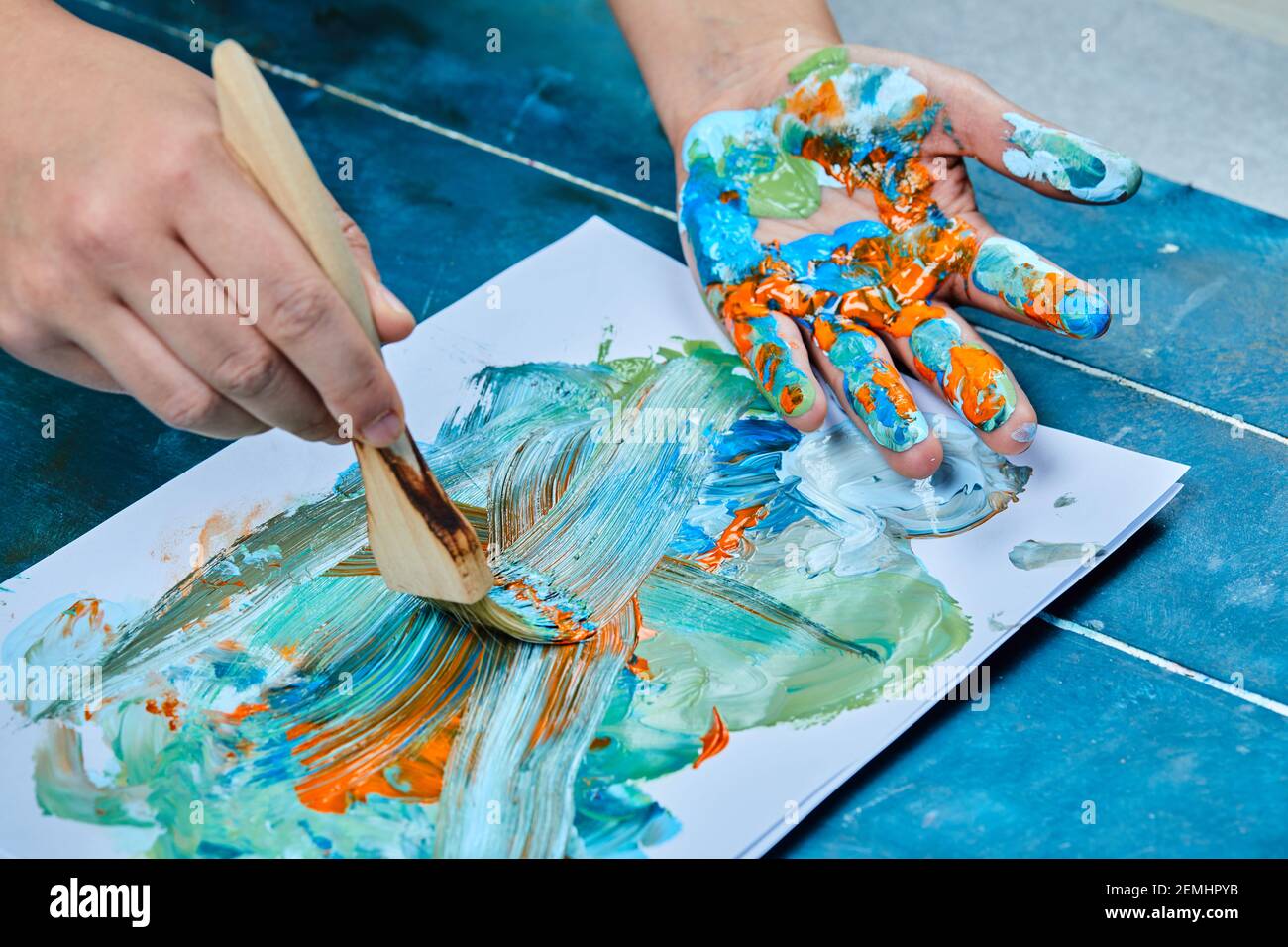 Artist drawing oil painting on white paper with paintbrush Stock Photo ...