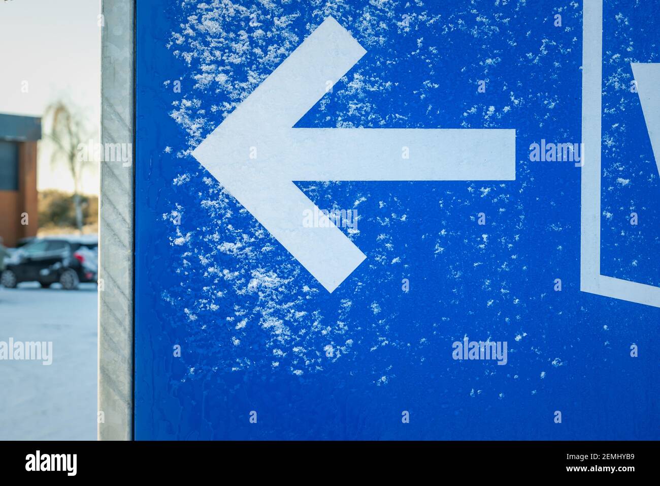 Directional arrow sign over customer parking in england uk Stock Photo ...