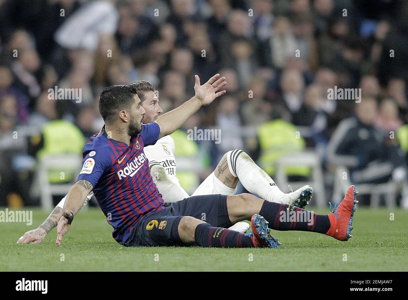 Real Madrid CF's Sergio Ramos and FC Barcelona's Luis Suarez during La ...