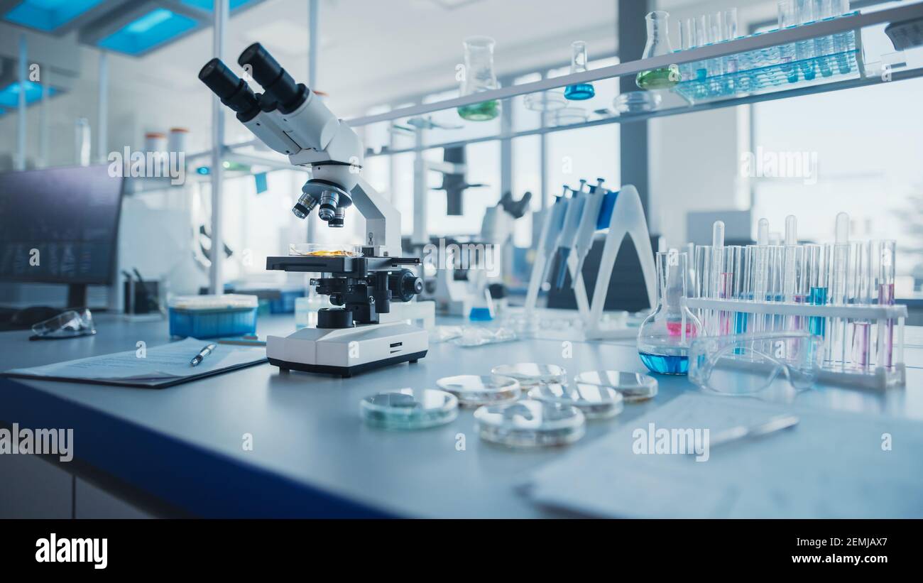 Modern Medical Research Laboratory with Microscope and Test Tubes with ...