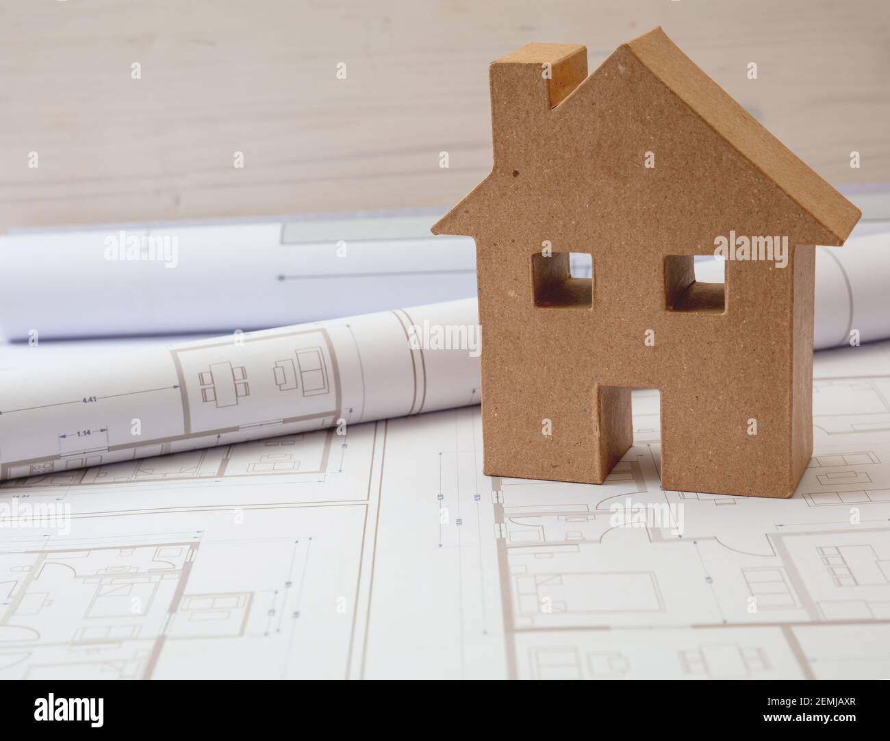 Construction blueprints concept. Housing project drawings and brown ...