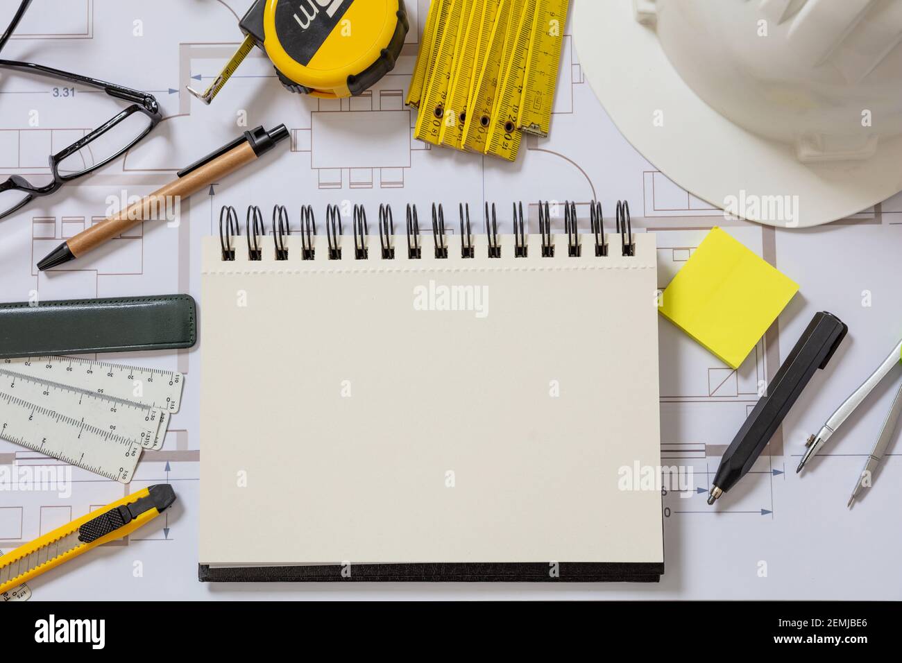 Architect engineer blank notebook, project blueprints background. Real ...