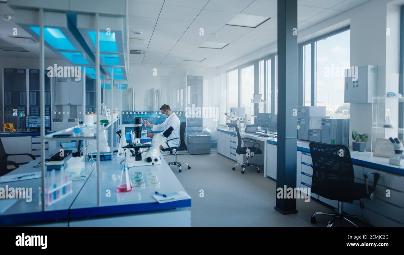 Modern Medical Research Laboratory: Caucasian Male Scientist Wearing ...