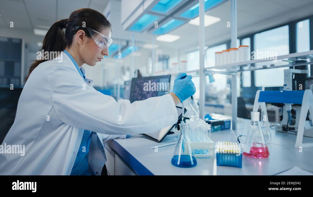 Modern Medical Research Laboratory: Female Scientist Working with Micro ...