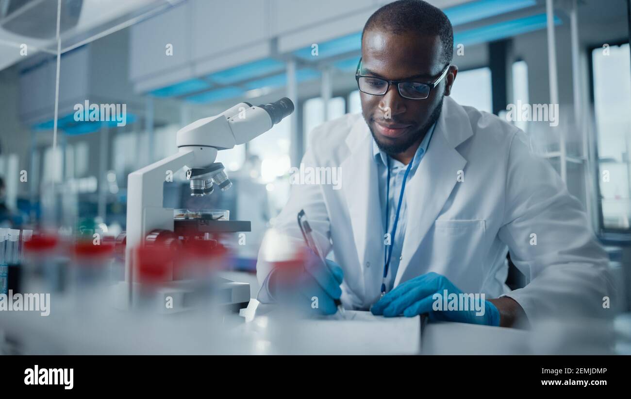 Modern Medical Research Laboratory: Portrait of Male Scientist Using ...