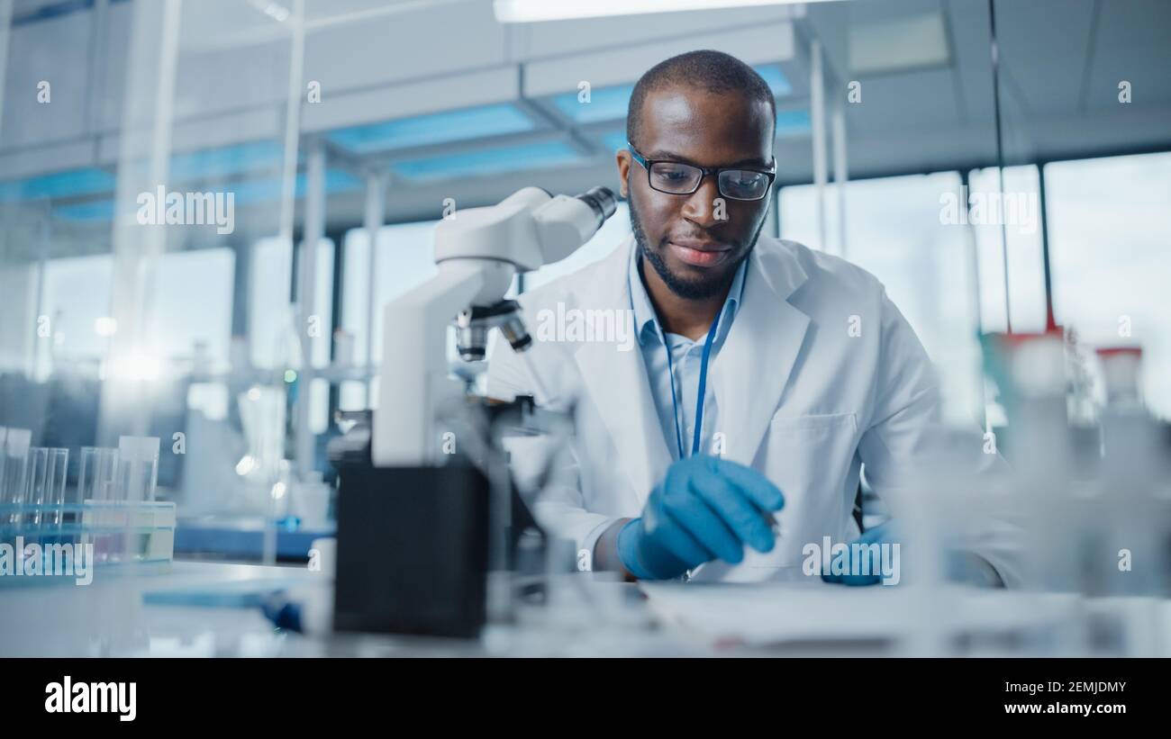 Modern Medical Research Laboratory: Portrait of Male Scientist Using ...