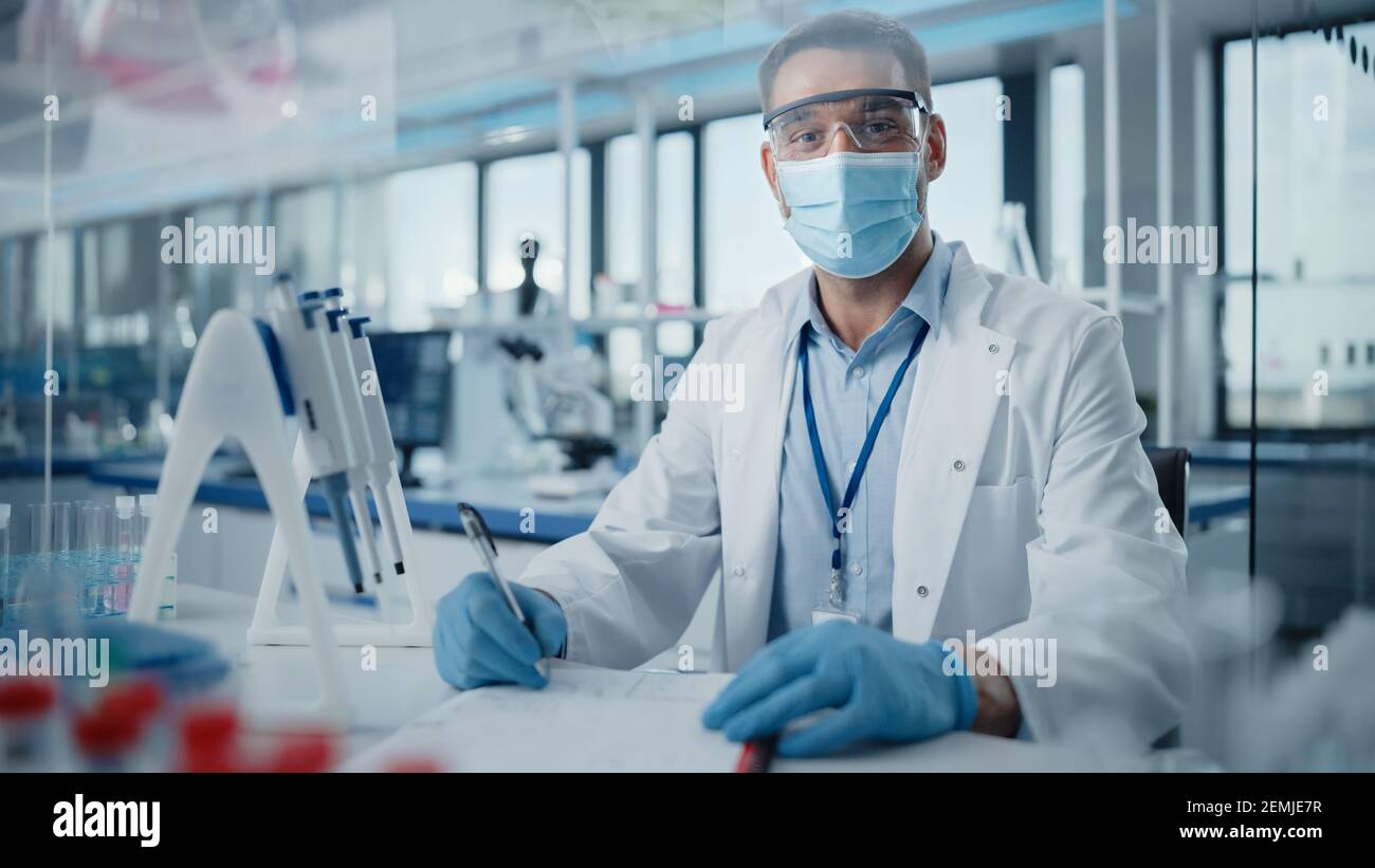 Scientist laboratory looking at camera hi-res stock photography and ...