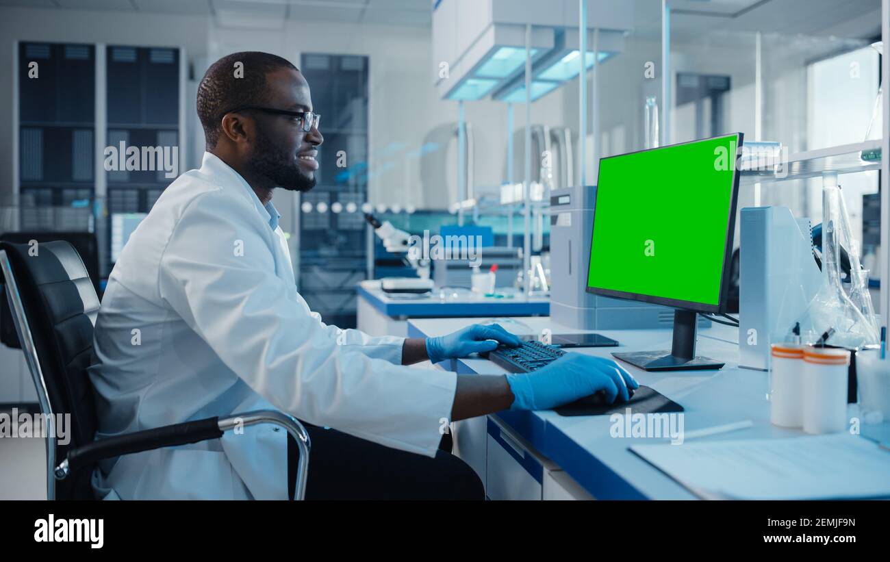 Modern Medical Research Laboratory: Portrait of Male Scientist working ...