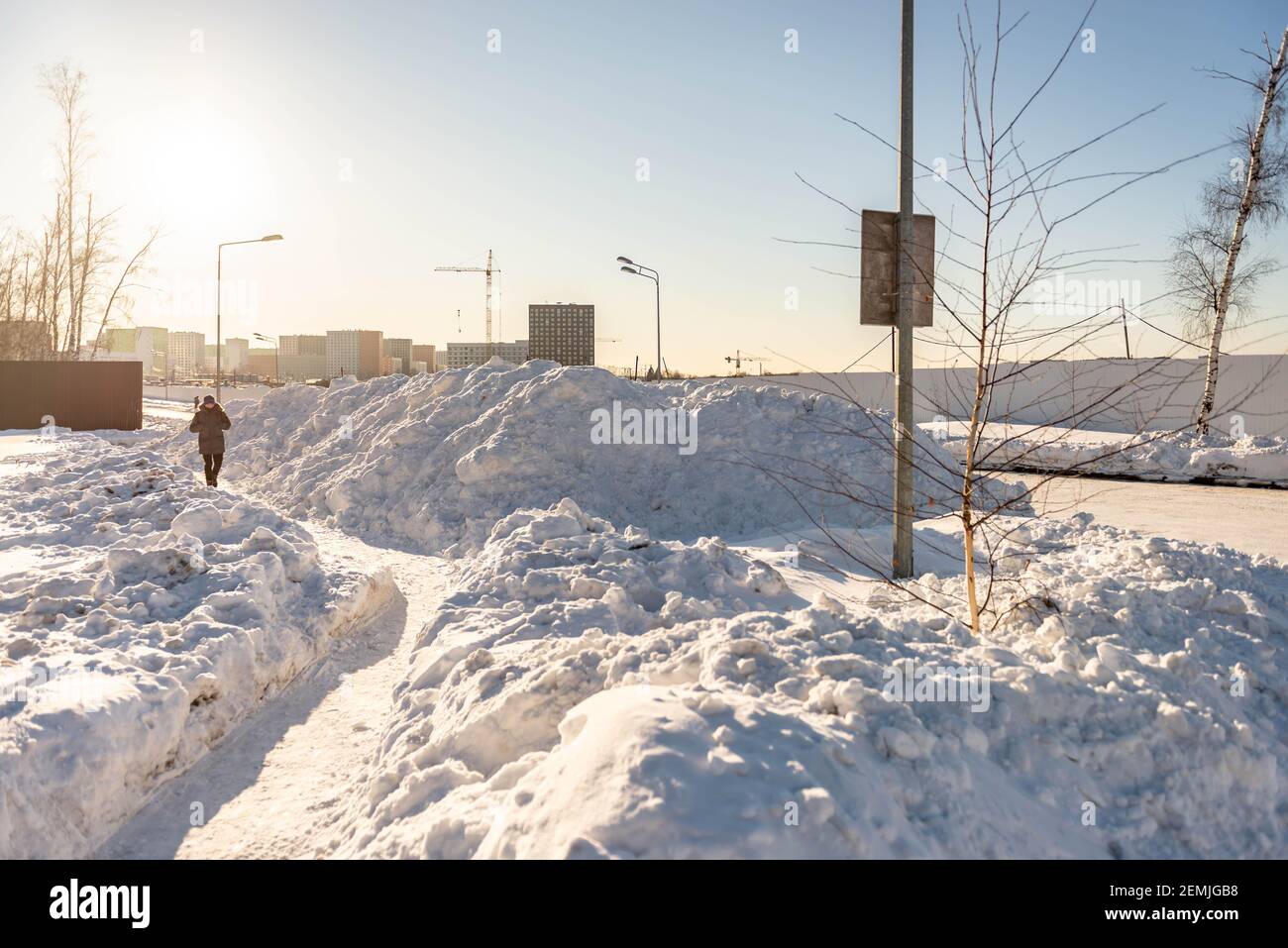 Moscow. Russia. February 2021. Cleared the snow from the paths after a ...