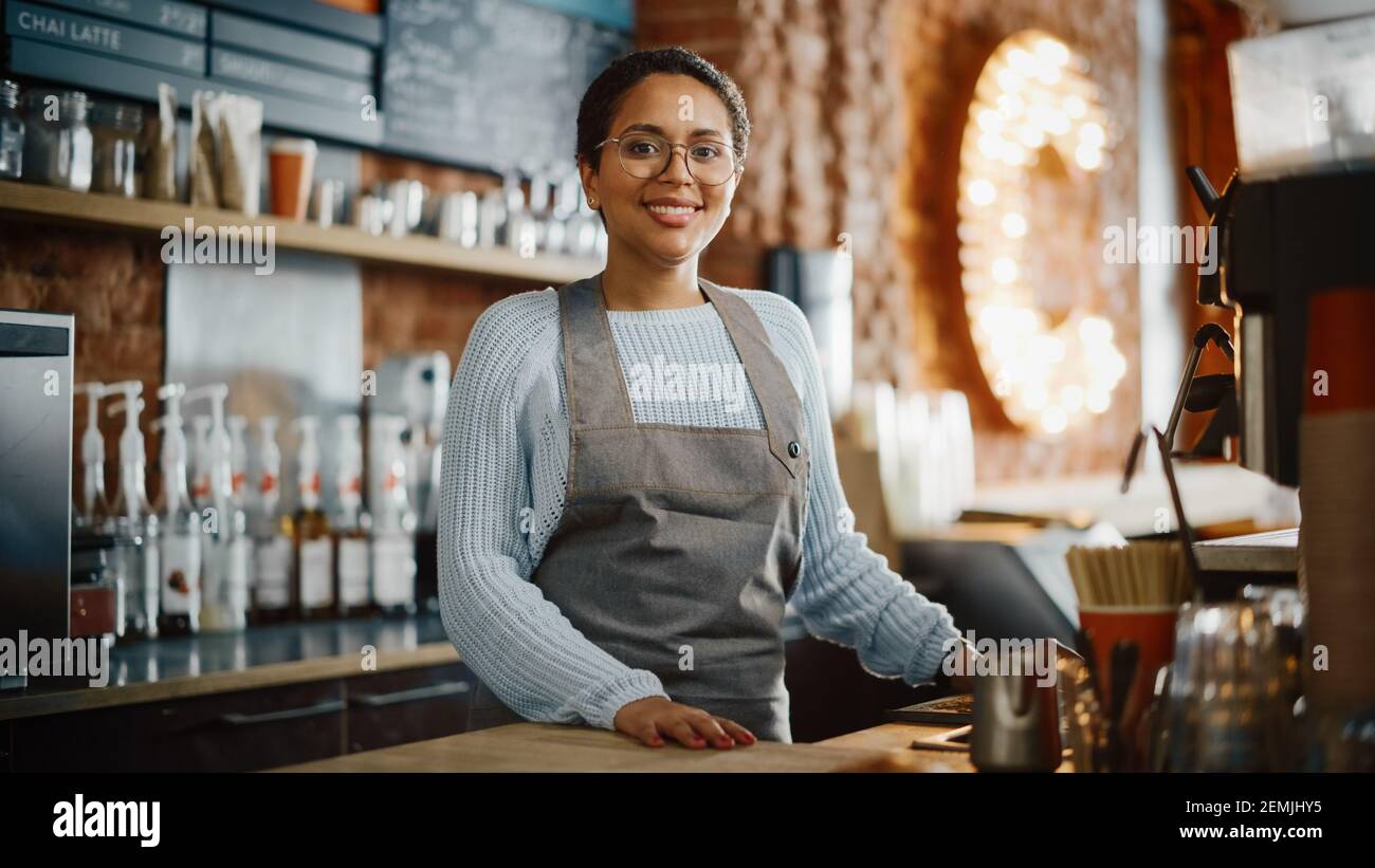Beautiful Latin American Female Barista with Short Hair and Glasses is ...