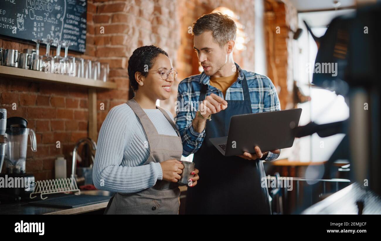 Two Diverse Entrepreneurs Have a Team Meeting in Their Stylish Coffee ...