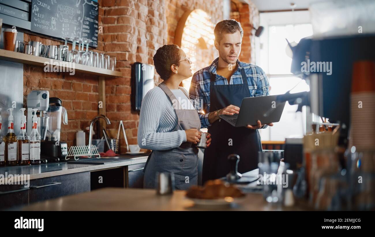 Two Diverse Entrepreneurs Have a Team Meeting in Their Stylish Coffee ...