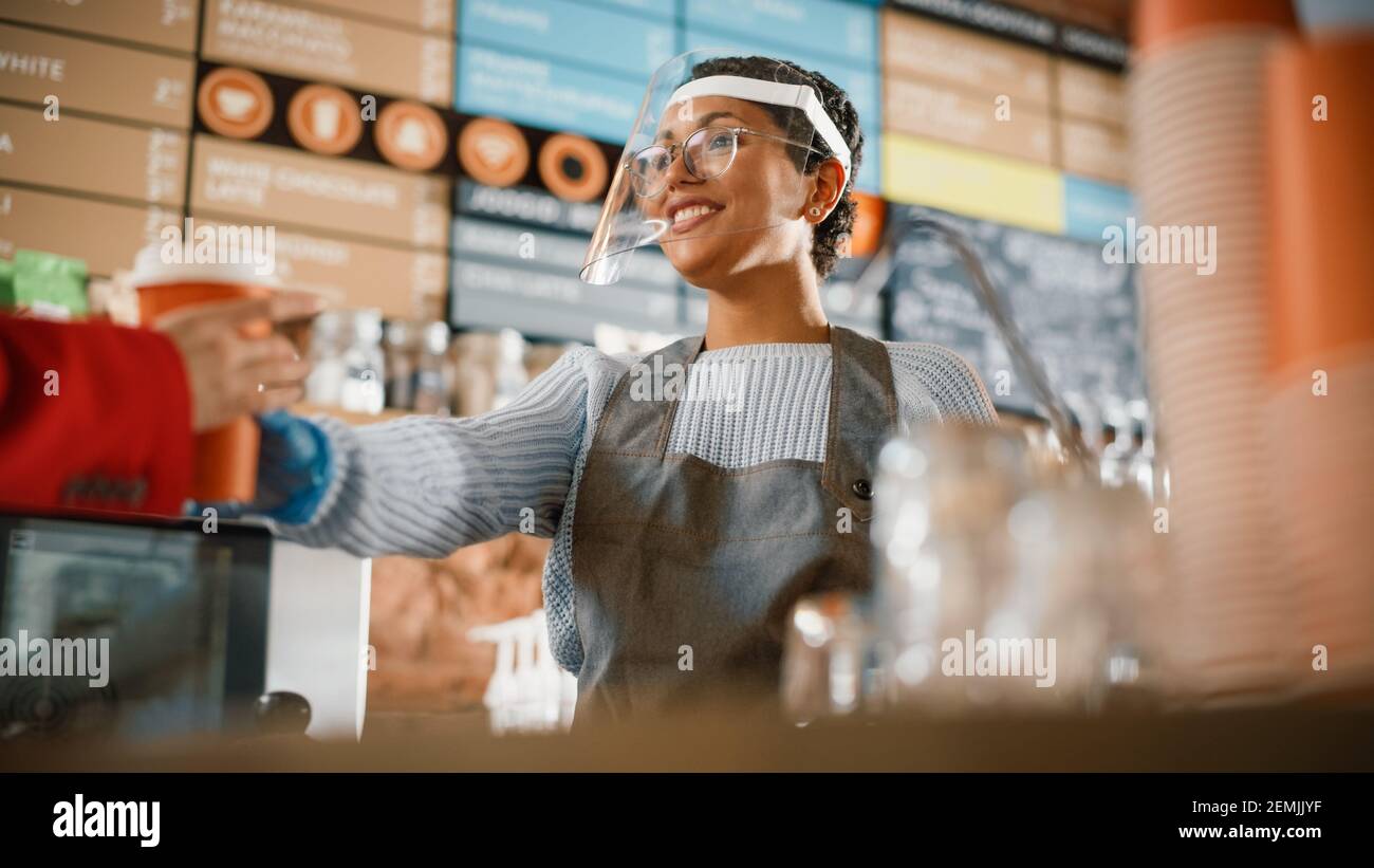 Beautiful Latin Female Barista in Face Shield and Gloves is Giving Take ...