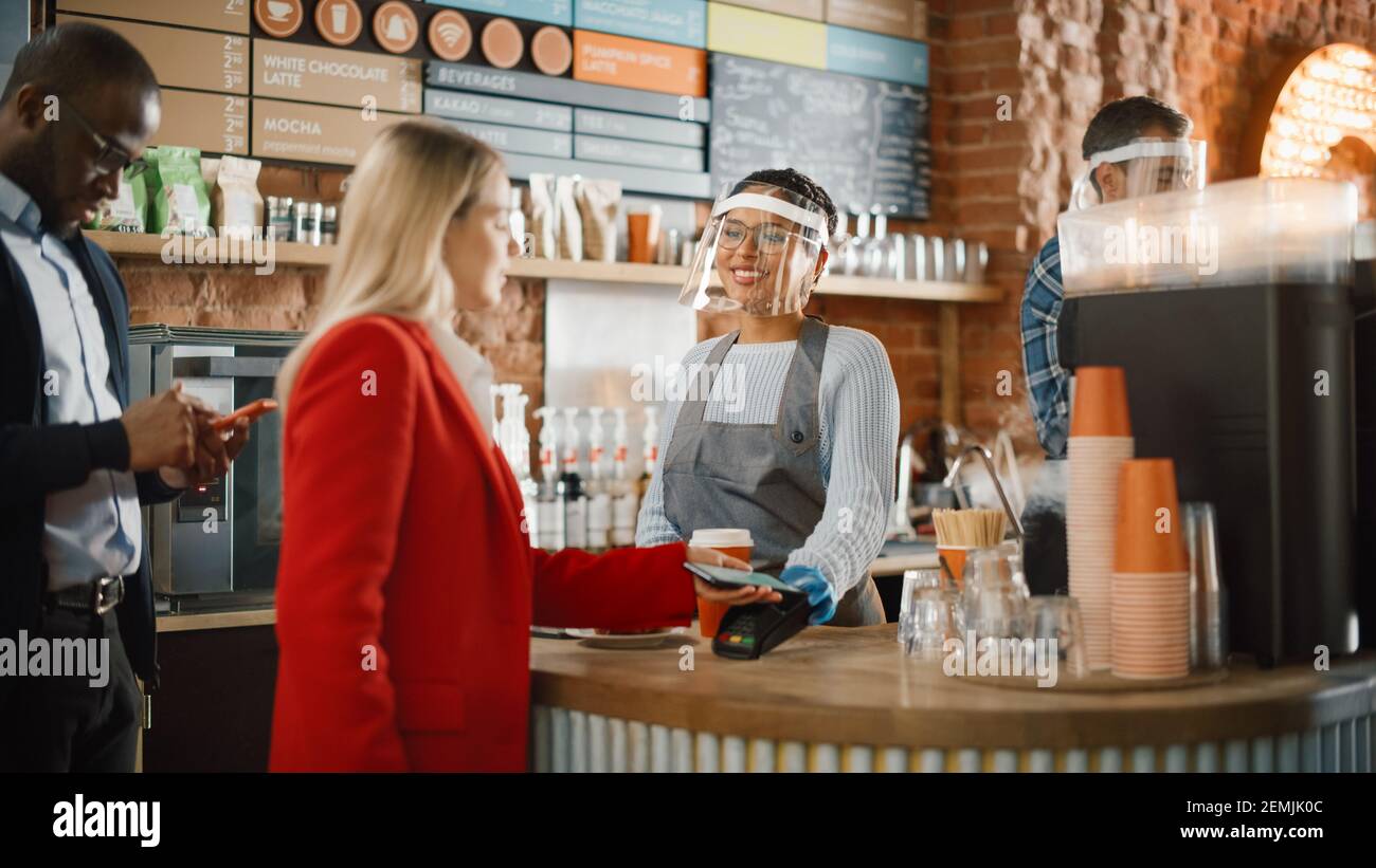 Female Customer Pays for Coffee and Pastry with Contactless NFC Payment ...