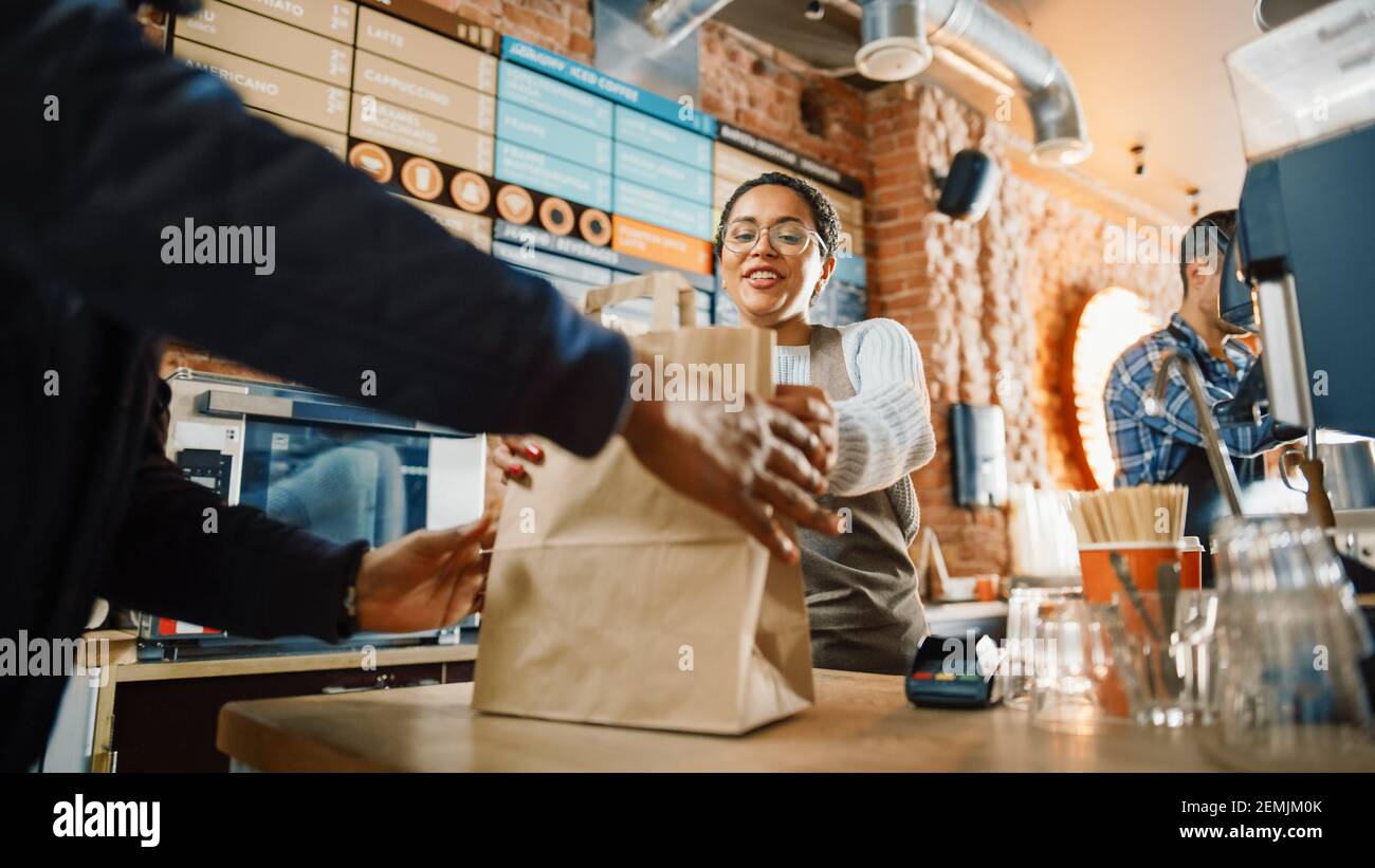Beautiful Happy Latin Barista Serves Order to a Food Delivery Courier ...
