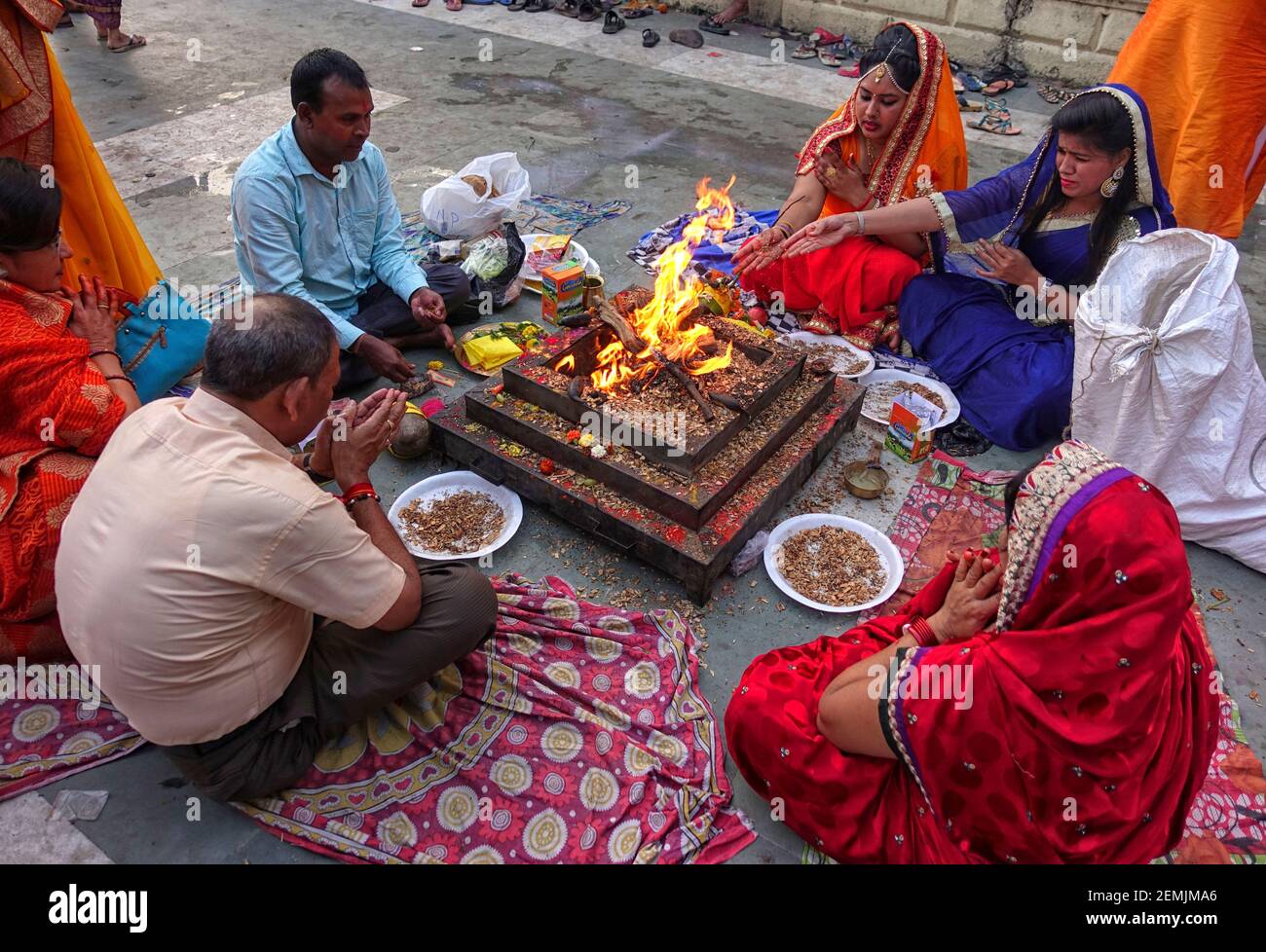 Hindu devotees seen praying while giving offering food on the idol of ...