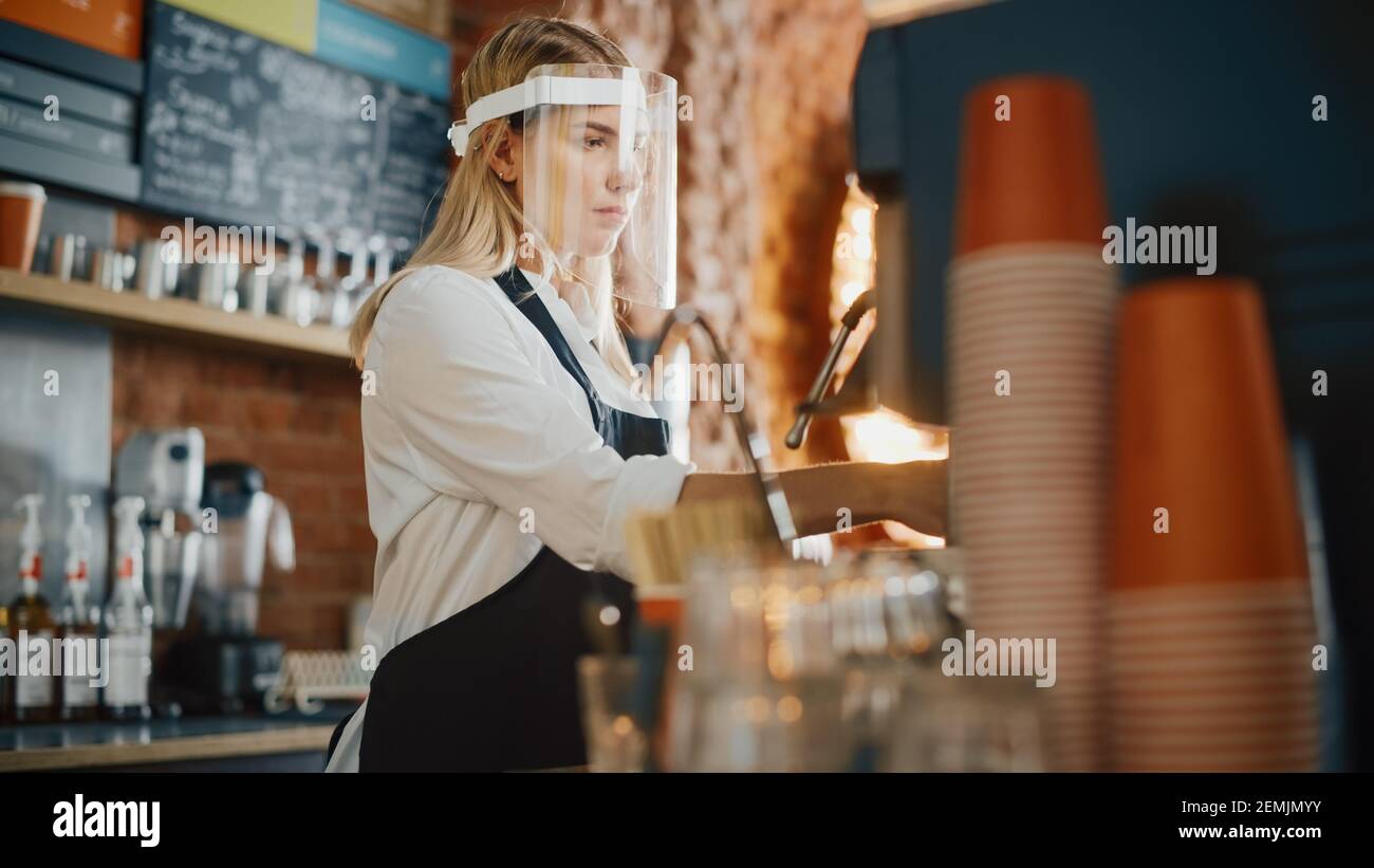 Cheerful young barista making hi-res stock photography and images - Alamy