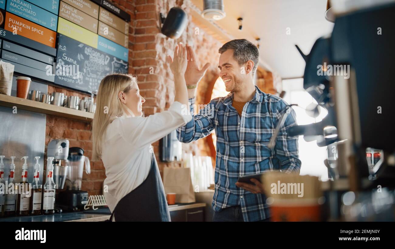 Two Diverse Entrepreneurs Have a Team Meeting in Their Stylish Coffee ...